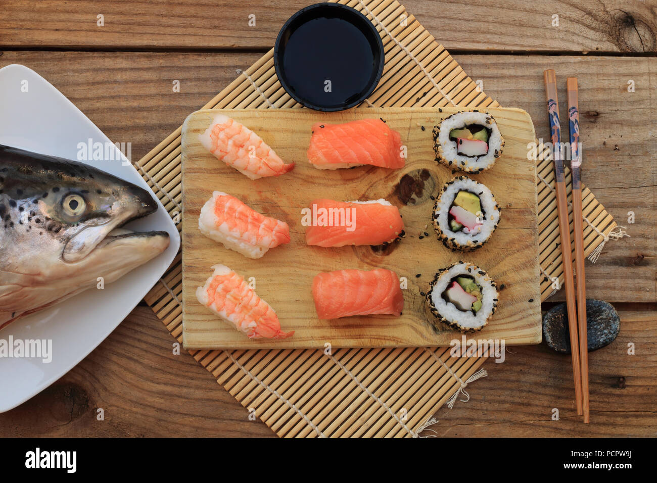Sushi is a tasty typical Japanese dish made with rice and fish or ...