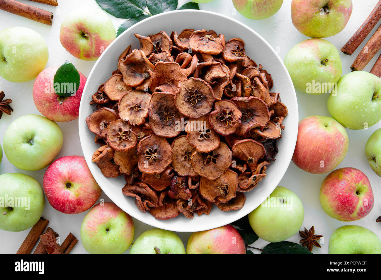 Homemade sun-dried organic apple slices (crispy apple chips) with fresh ...