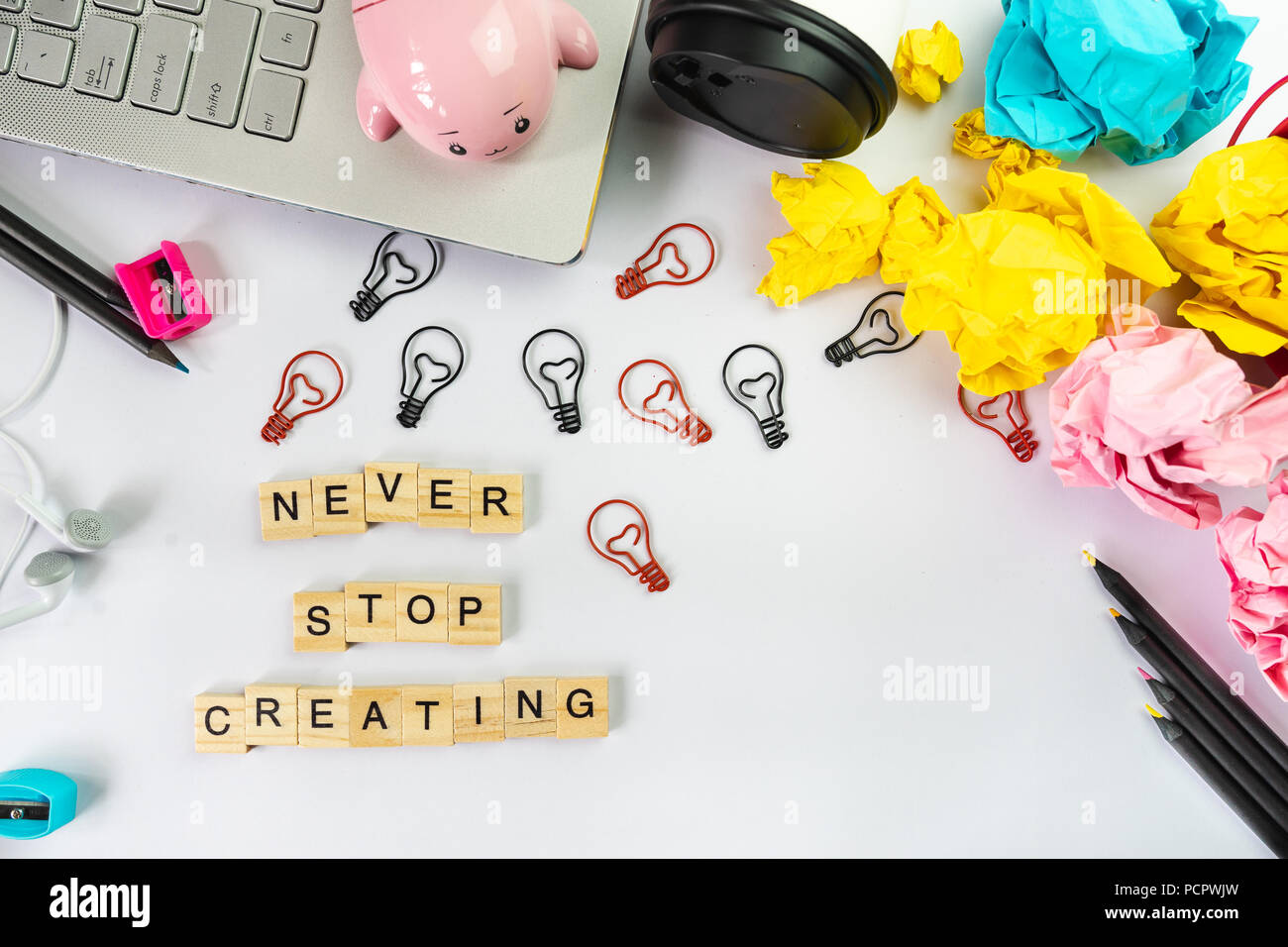 Never stop creating word on wooden block, creative idea concept with ...