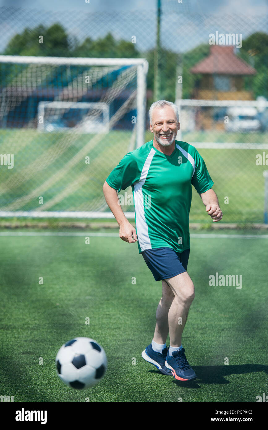 Old man playing football hi-res stock photography and images - Alamy