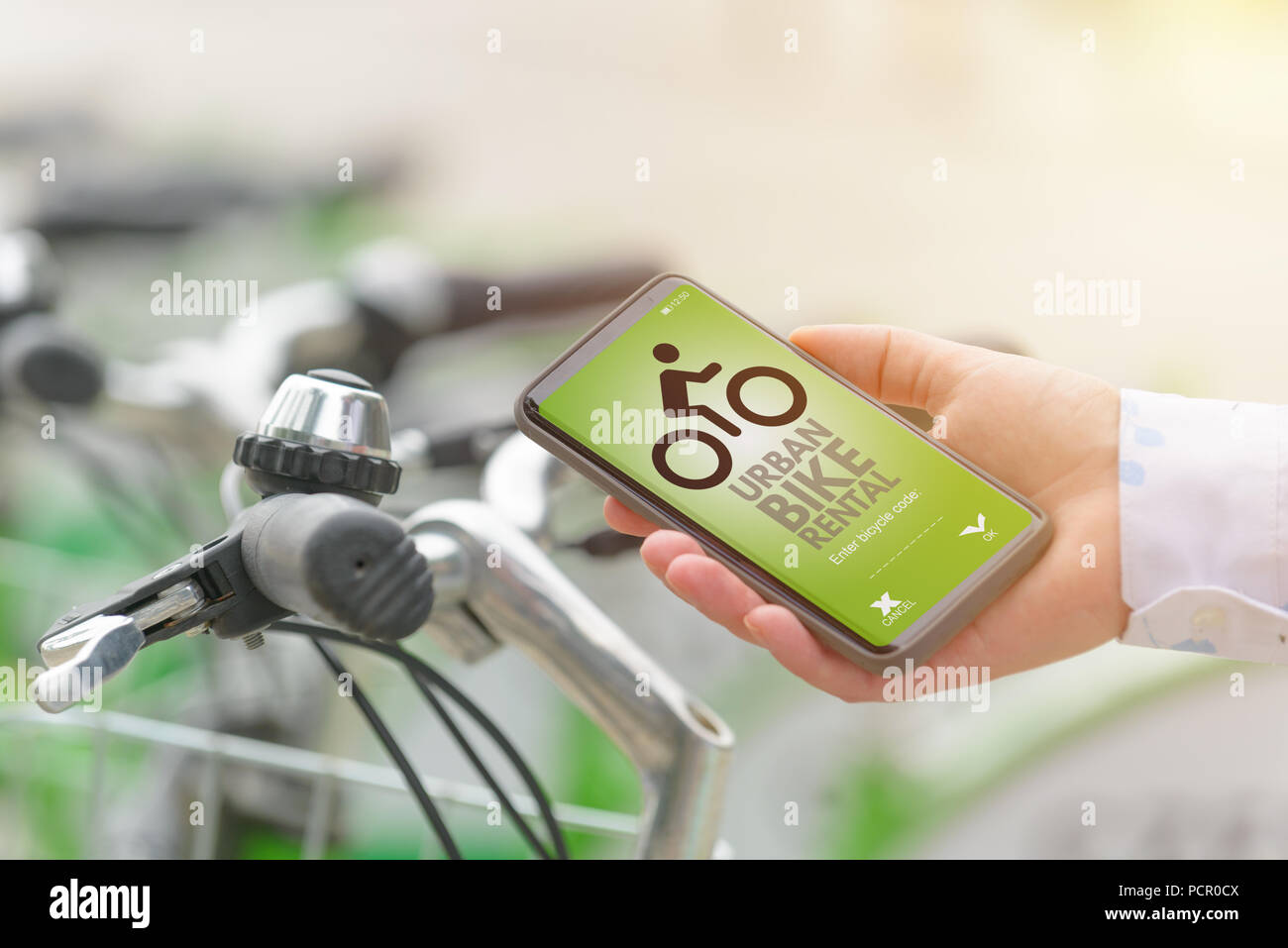 Using smartphone on bicycle hi-res stock photography and images - Alamy