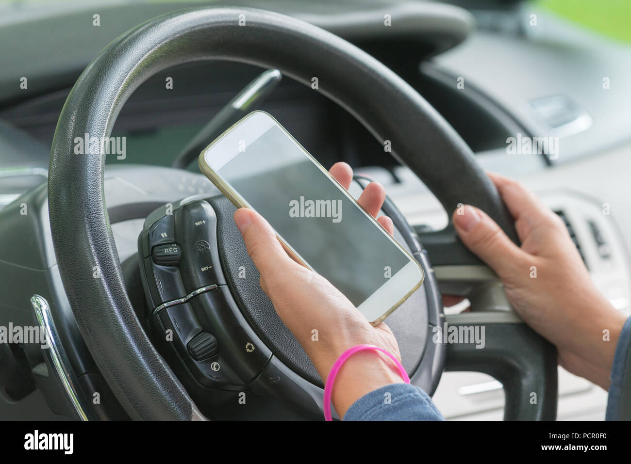 Using phone while driving the car. Risky driving behaviors concept ...