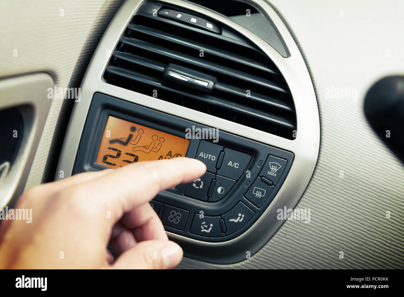 Driver using ac air-condition system and pushing button car screen ...