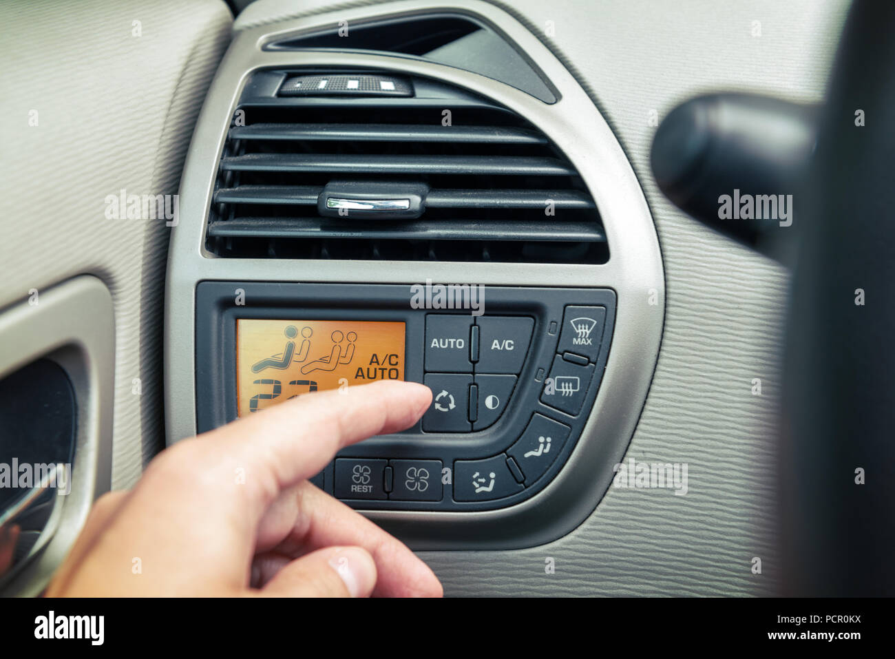 Driver using ac air-condition system and pushing button car screen ...