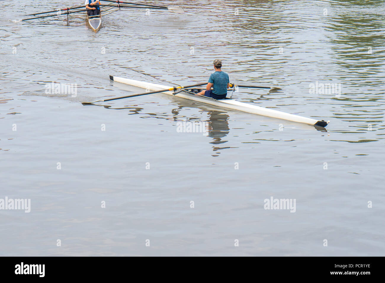 Young sportsmen in a boat, rowing on the river Rioni, Poti, Georgia ...