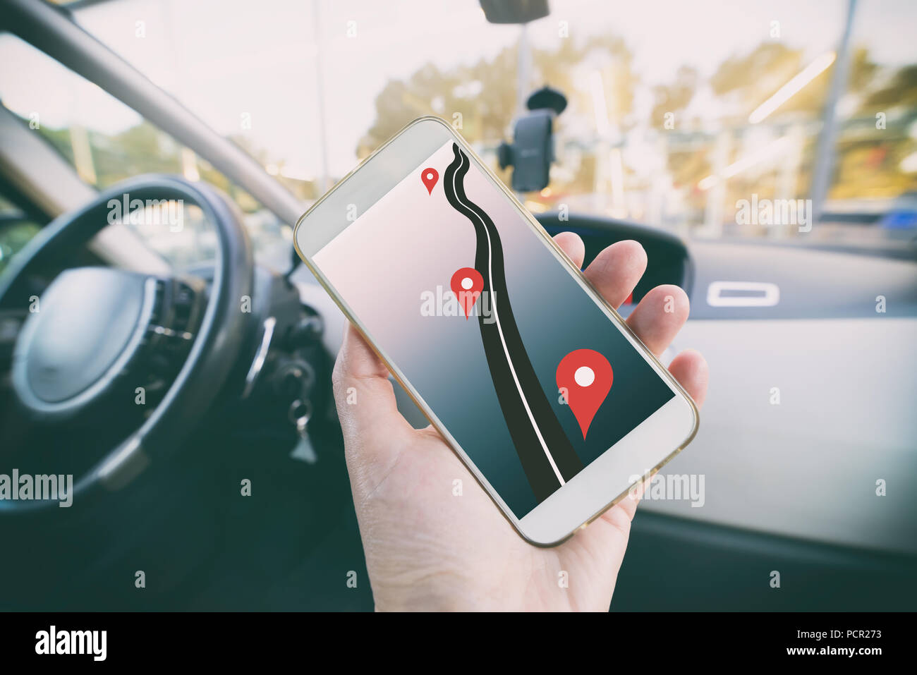 Closeup of smartphone in hand with navigation on screen Stock Photo - Alamy