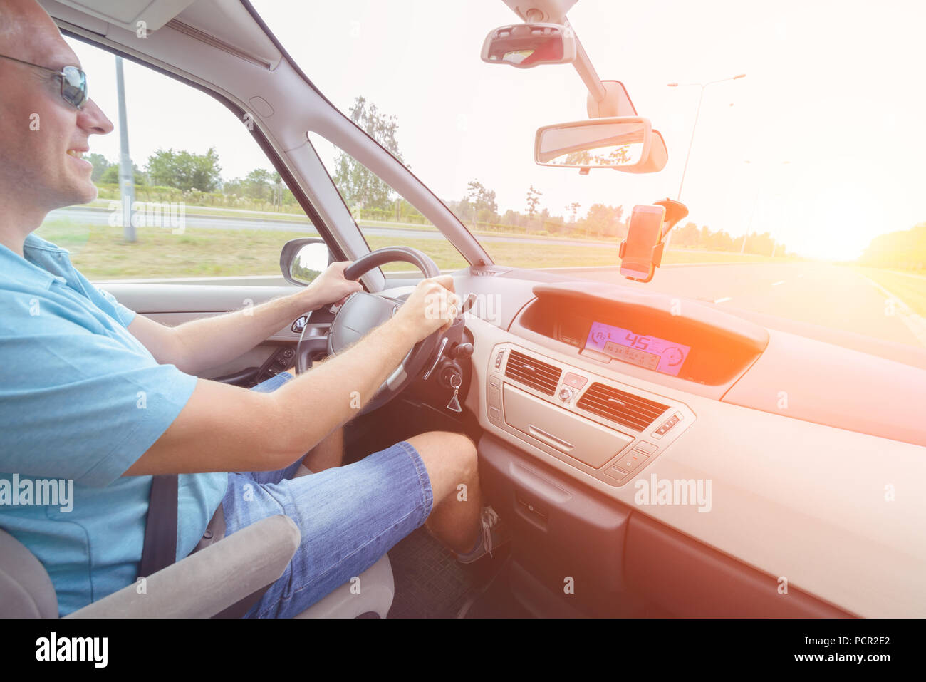 Driving a car - passenger seat view. Hands on steering wheel Stock ...
