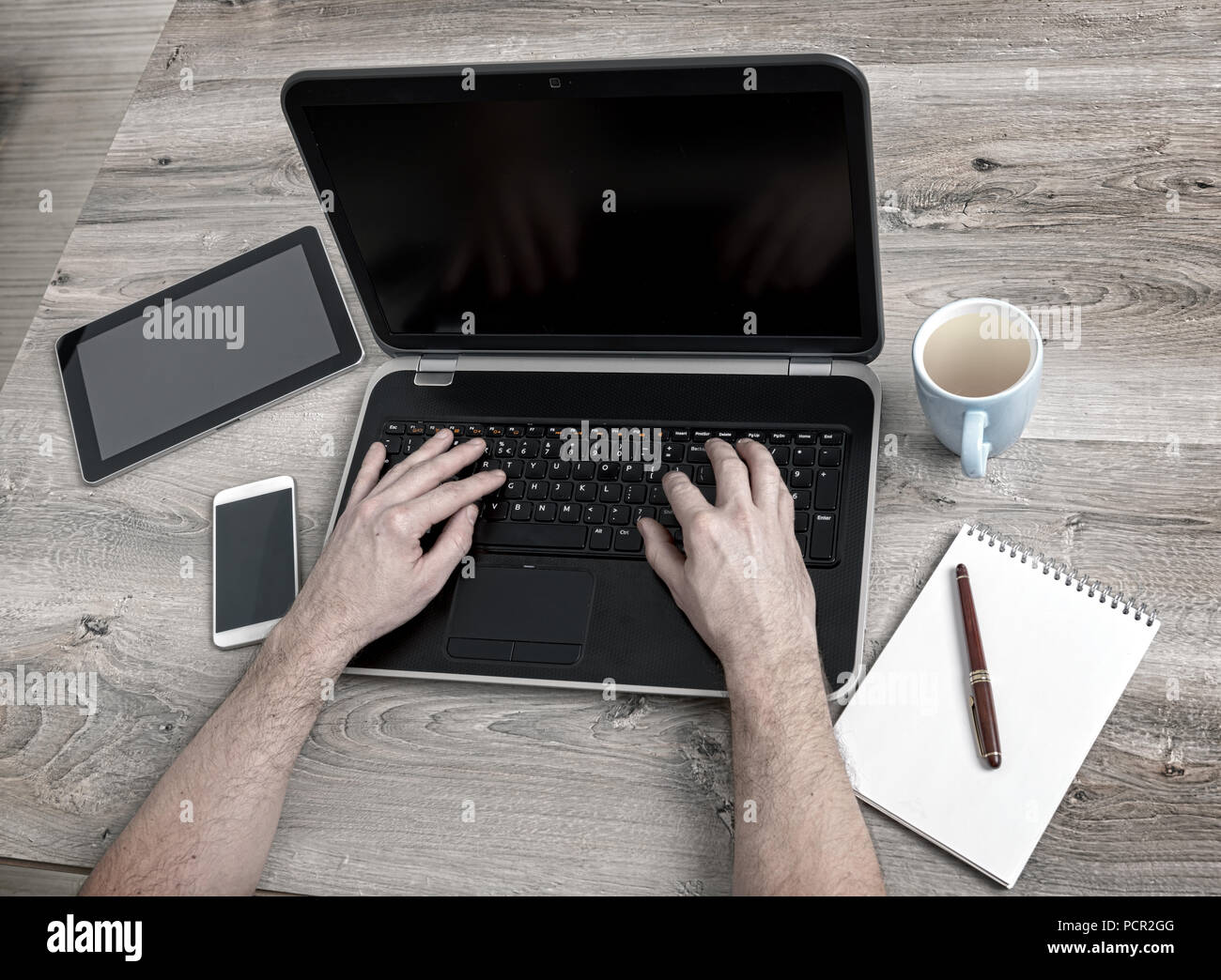 Concept of modern working style. Hands on laptop keyboard. Aerial ...