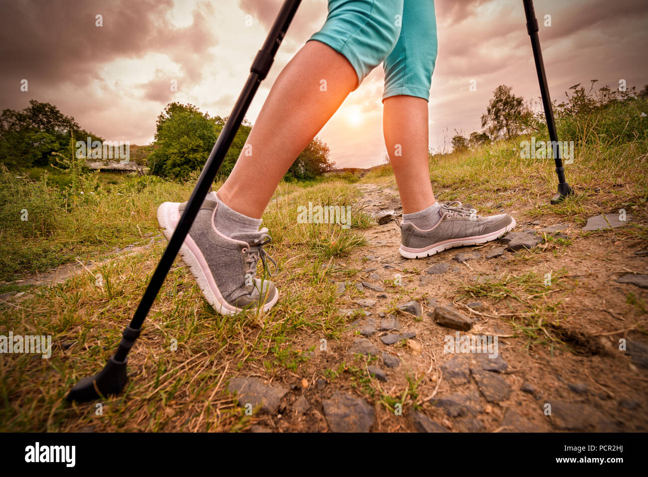 Woman hiking with sticks outdoor Active and healthy lifestyle concept ...