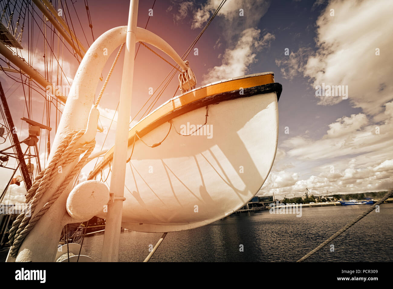 Life boat hanging on a big sailing ship Stock Photo - Alamy