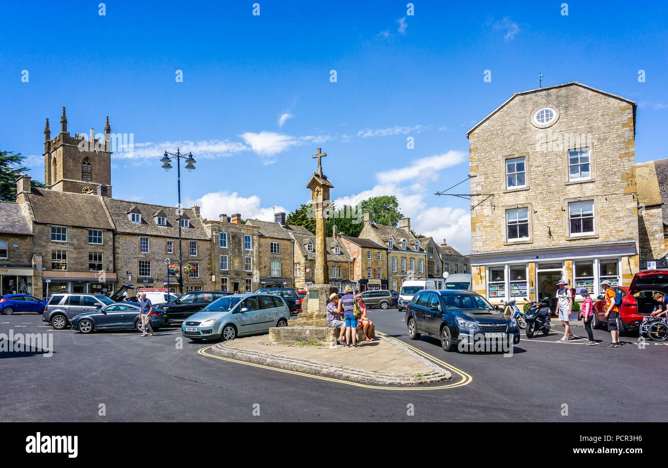 Streets and shops and market cross in historic cotswold town of Stow on ...