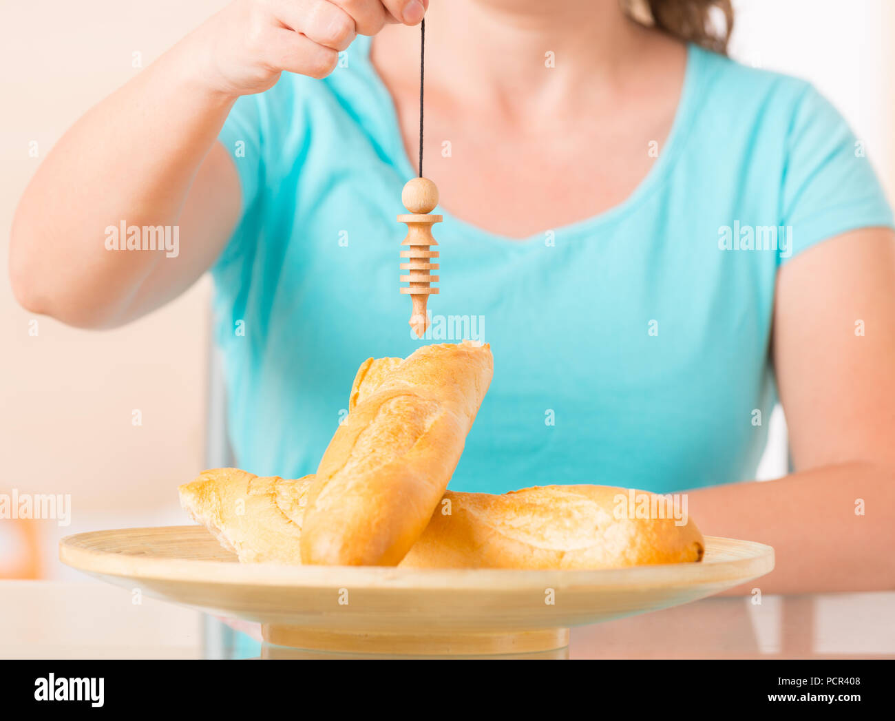 Woman pendulum dowsing hi-res stock photography and images - Alamy