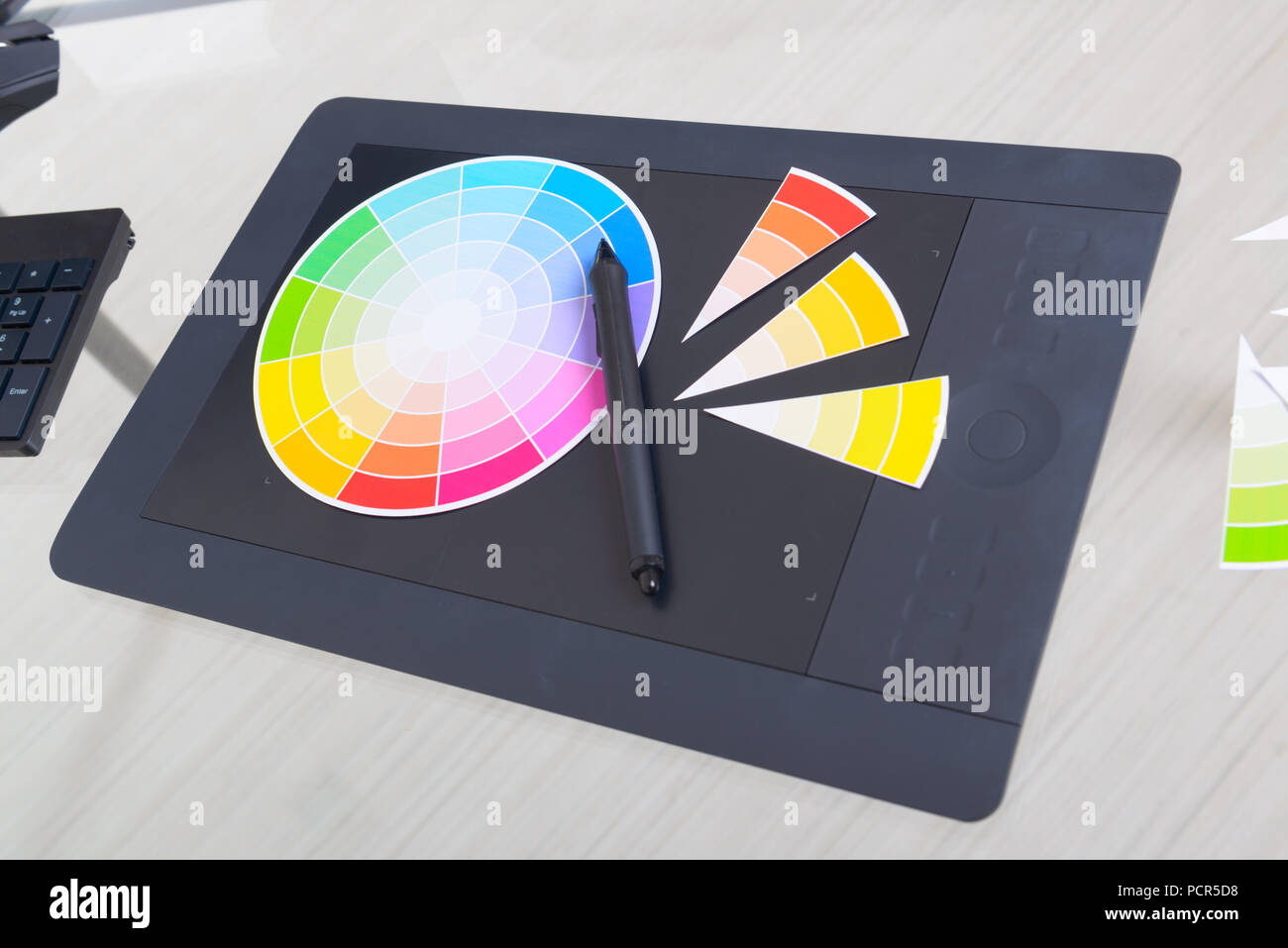 Color wheel and swatches of colour with stylus on a graphic tablet ...
