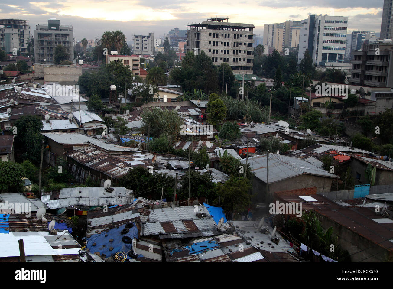 Poor district with corrugated iron huts on the outskirts, city view ...