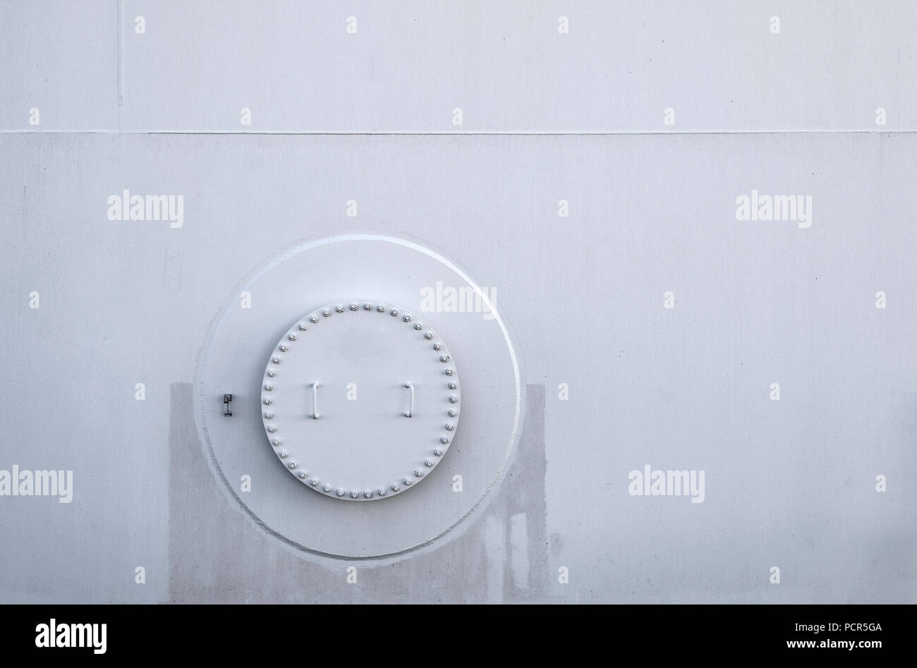Round Metal Door Hatch With Bolts Stock Photo - Alamy