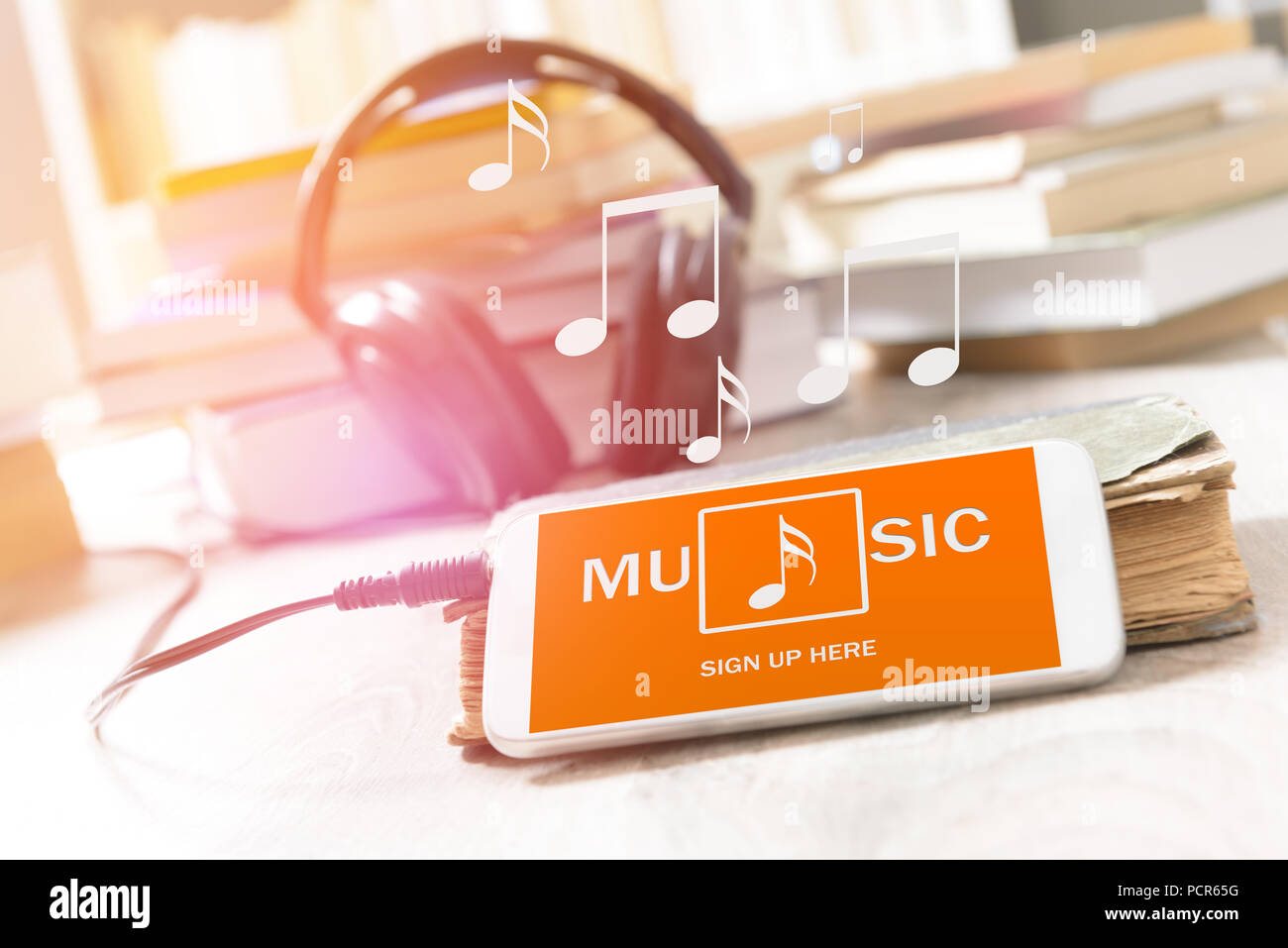 Mobile phone with music application screen on a display with headphones ...