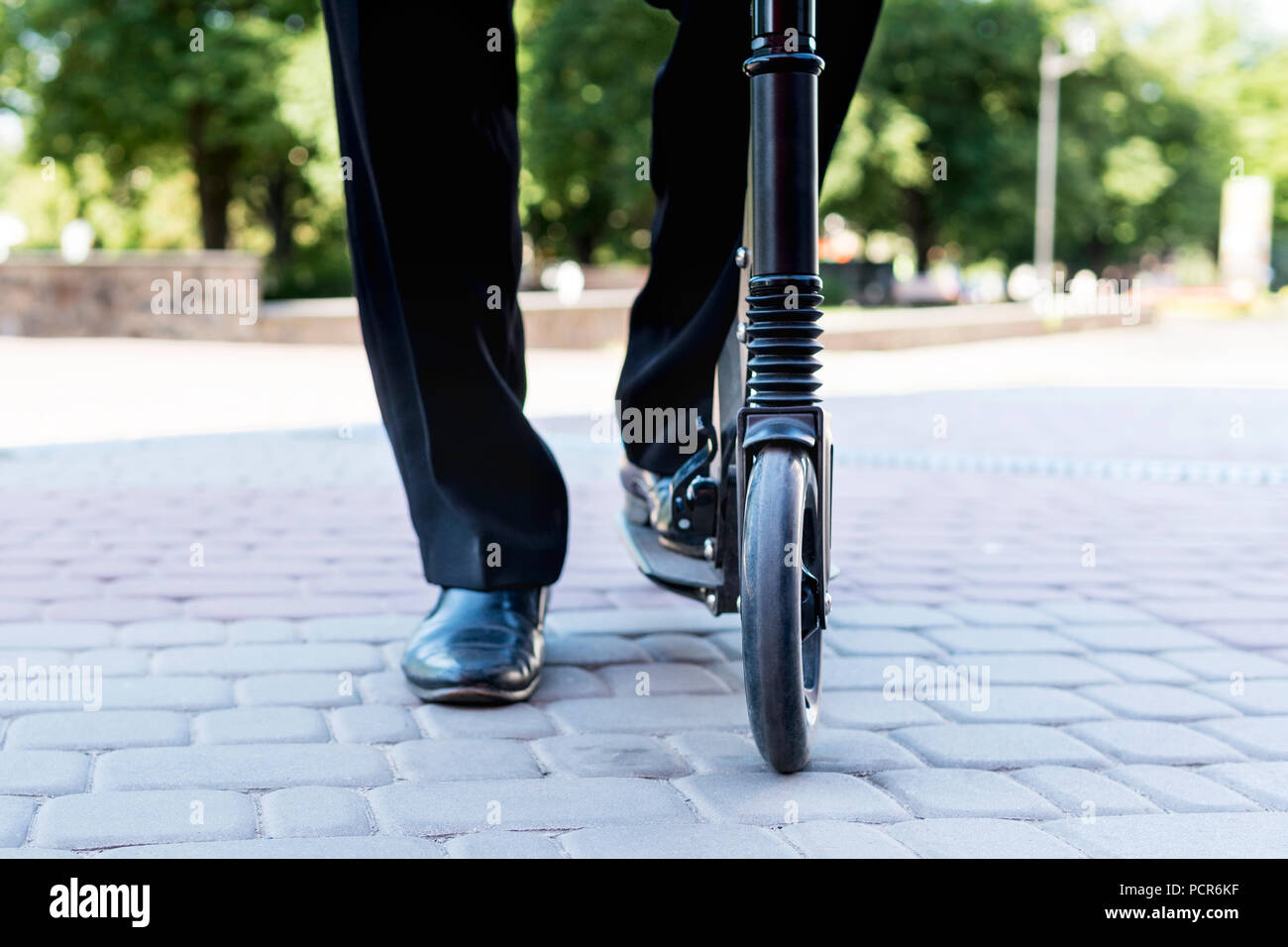 Male feet on the scooter Stock Photo - Alamy