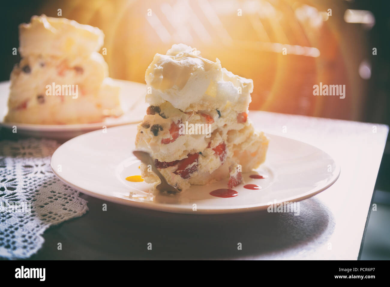 Delicious meringue on a plate in retro style cafe Stock Photo - Alamy