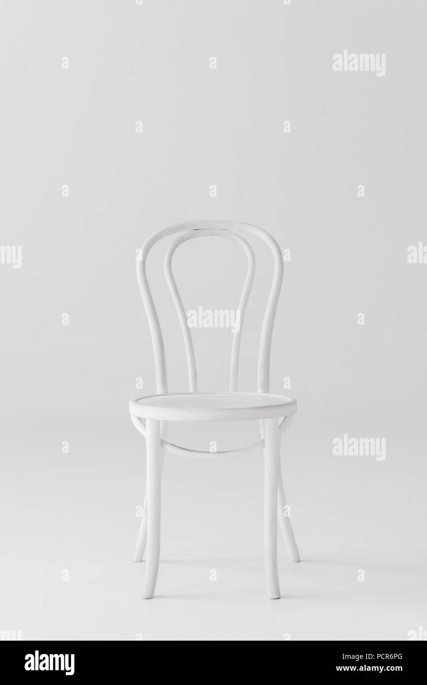 front view of white chair isolated on grey background Stock Photo - Alamy