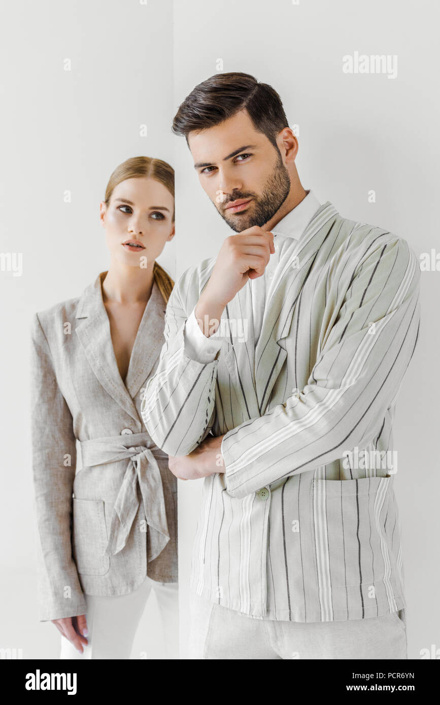 attractive young male and female models in vintage jackets on white ...