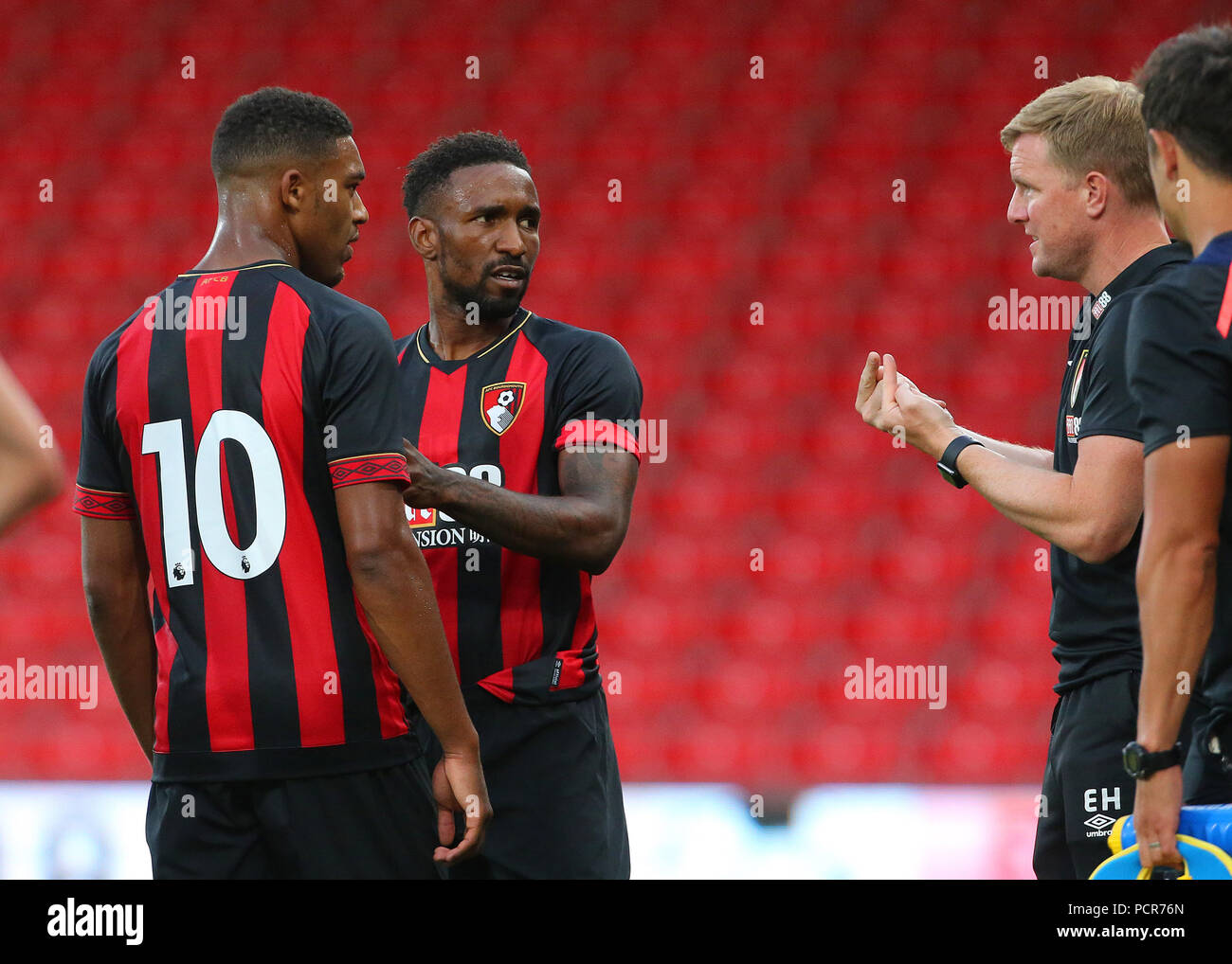 Bournemouth's Jermain Defoe and Jordon Ibe receive instructions from ...
