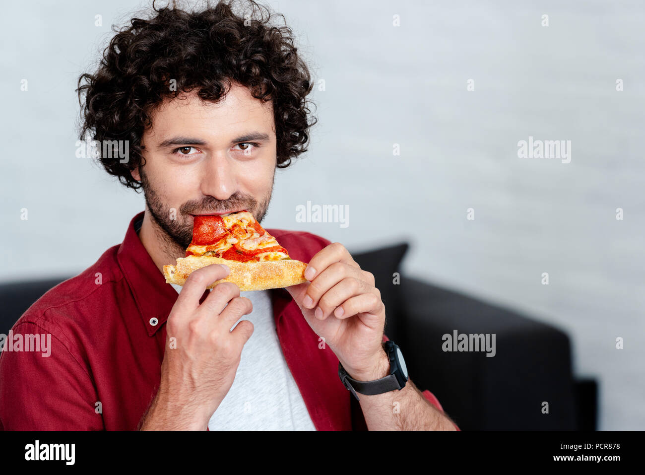 Man eating pizza hi-res stock photography and images - Alamy