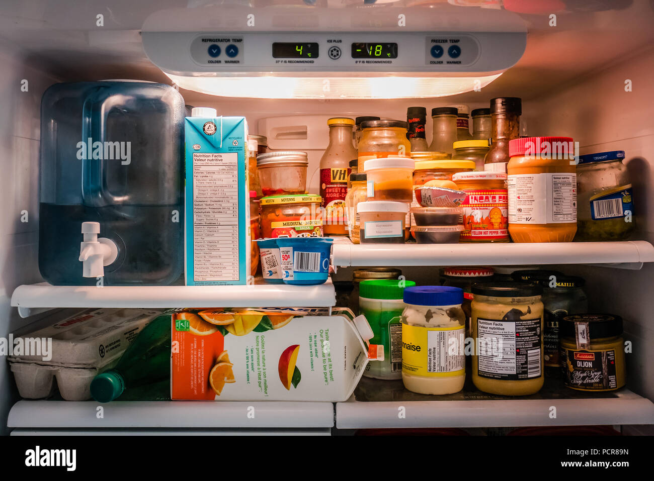 packed and filled up refrigerator Stock Photo - Alamy
