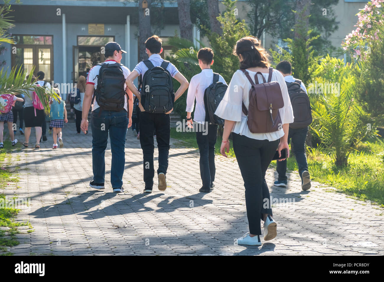 Group of kids going to school, education Stock Photo - Alamy