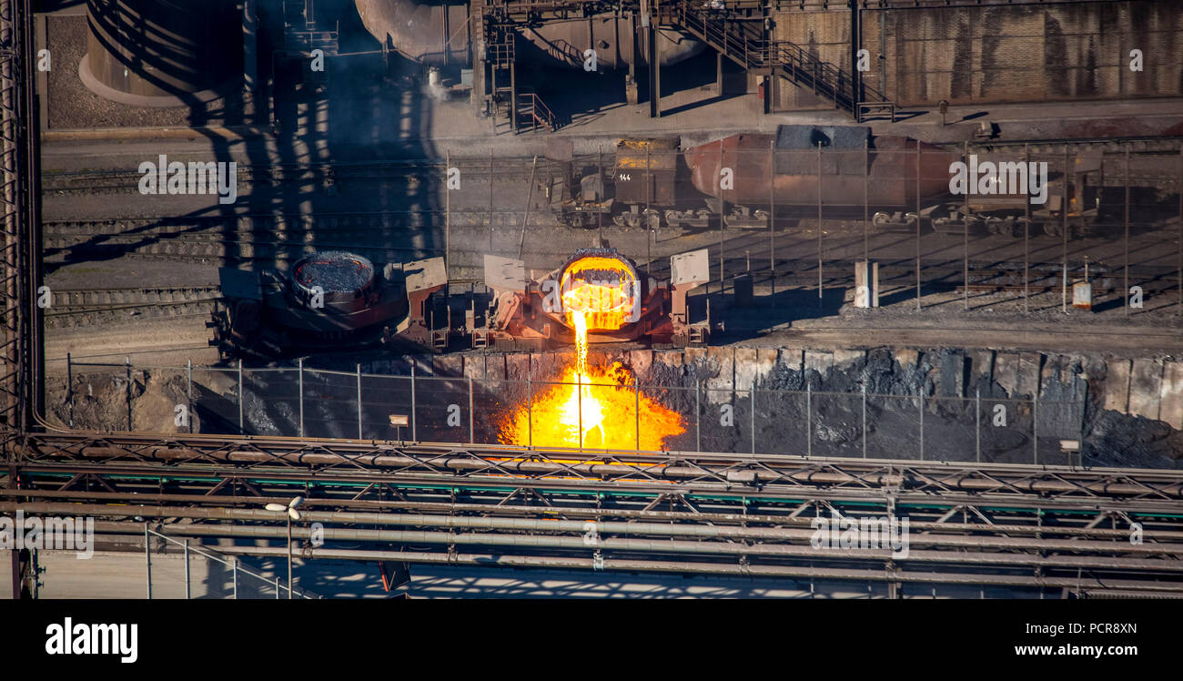 hot slag from the iron production is dumped from a torpedo ladle car ...