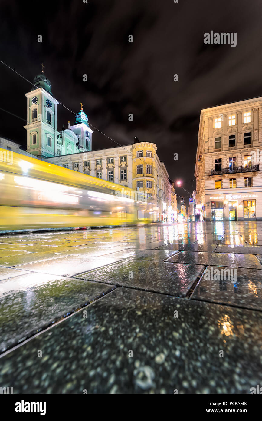 Linz main square at night, tramway going by Stock Photo - Alamy