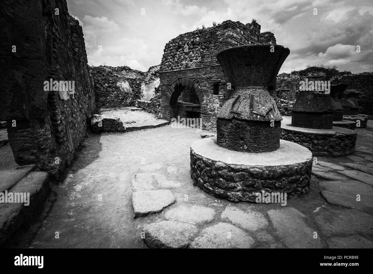 Mills and a masoned clay oven at the House of the Baker, the Casa del ...