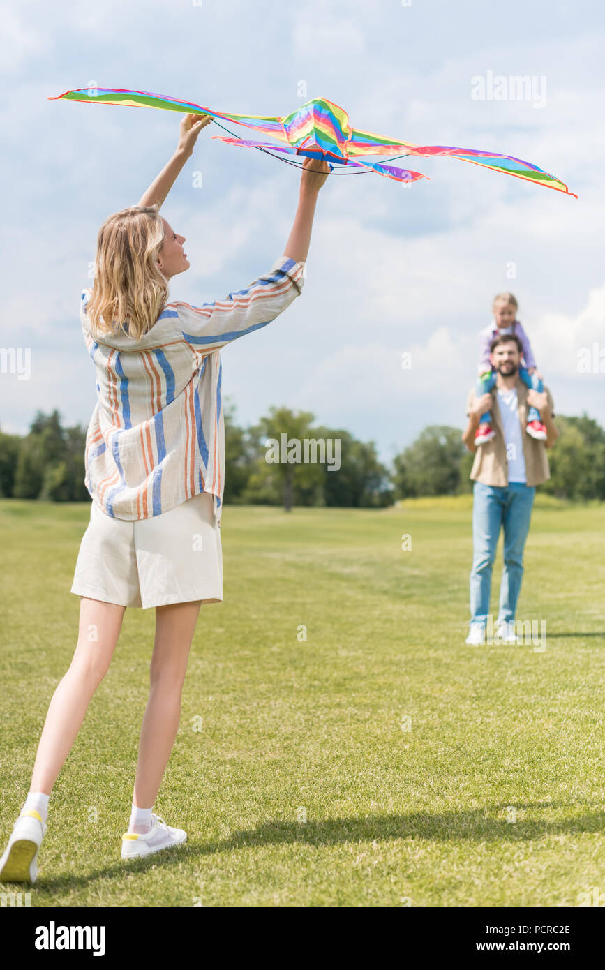 Young woman carrying girl kite hi-res stock photography and images - Alamy