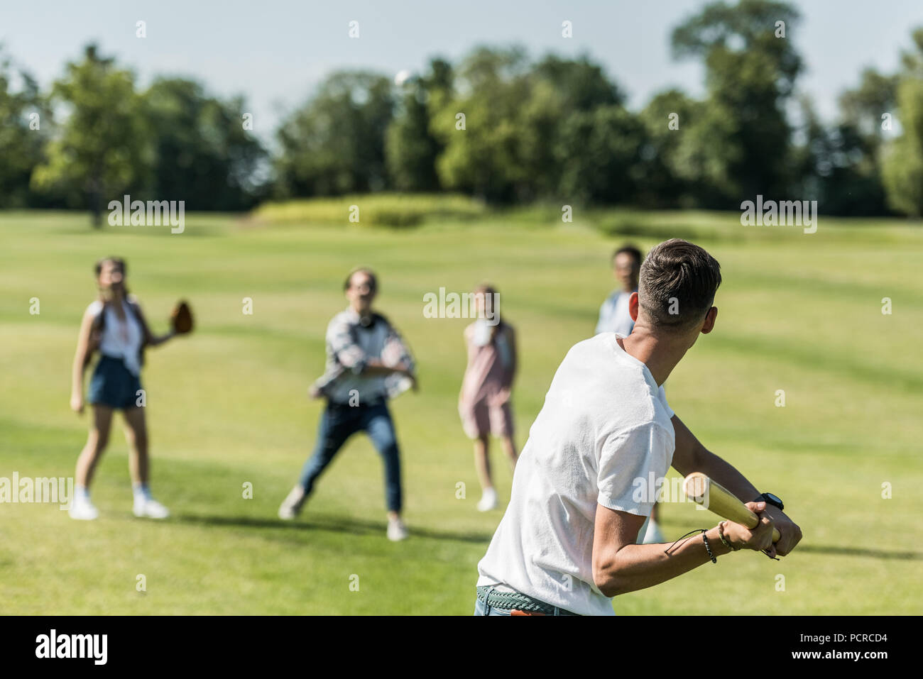 Teenage boys and girls playing baseball hi-res stock photography and ...