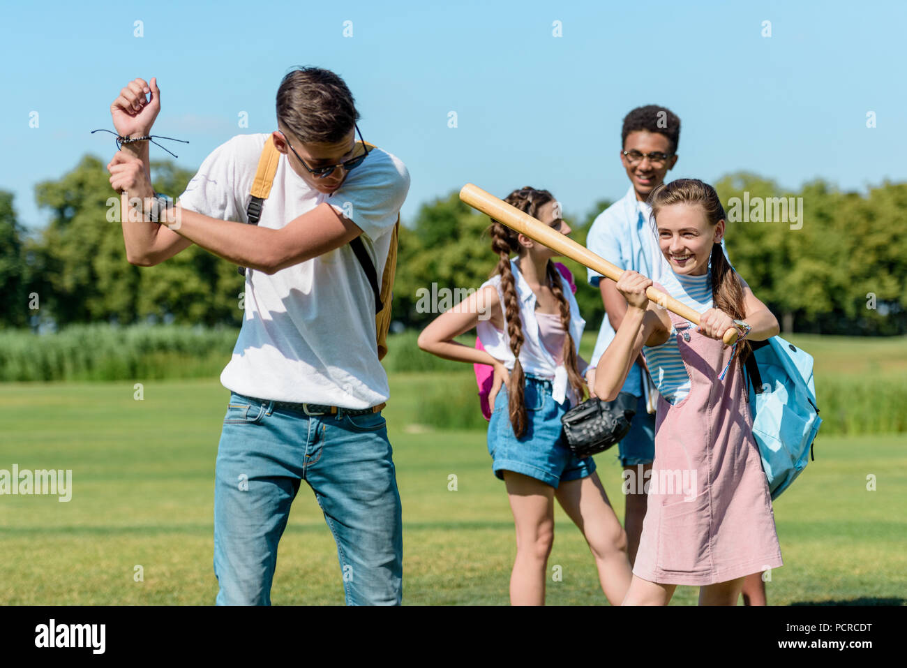 Teenage boys and girls playing baseball hi-res stock photography and ...