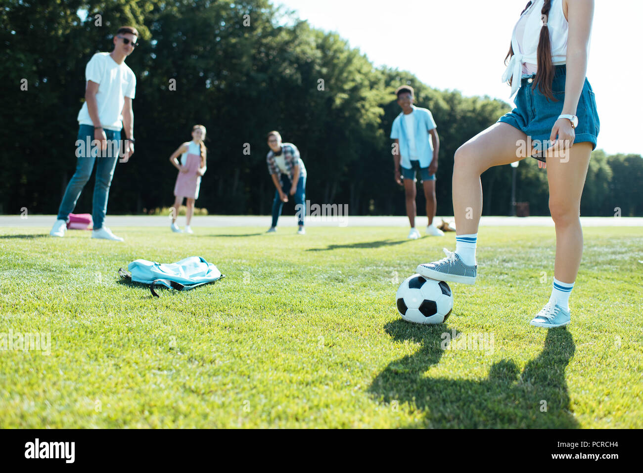 teenage multiethnic friends playing with soccer ball in park Stock ...