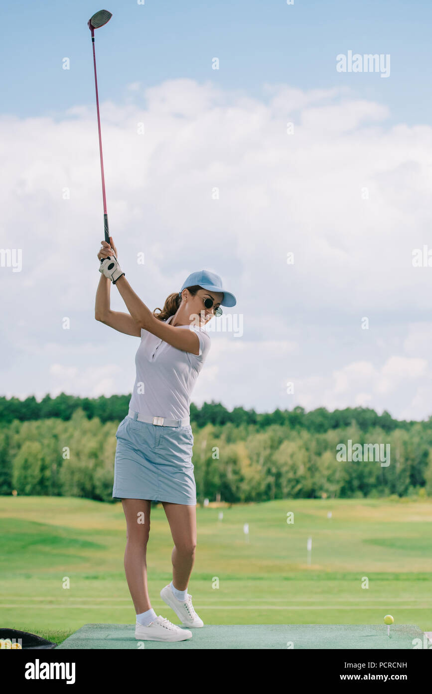 Side view woman playing golf hi-res stock photography and images - Alamy