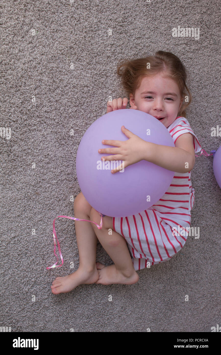 girl with balloons, child with balloons, child with balloons lying on ...