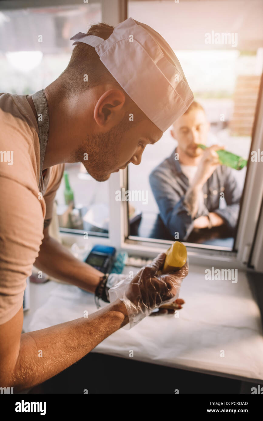 chef preparing hod dog in food truck Stock Photo - Alamy