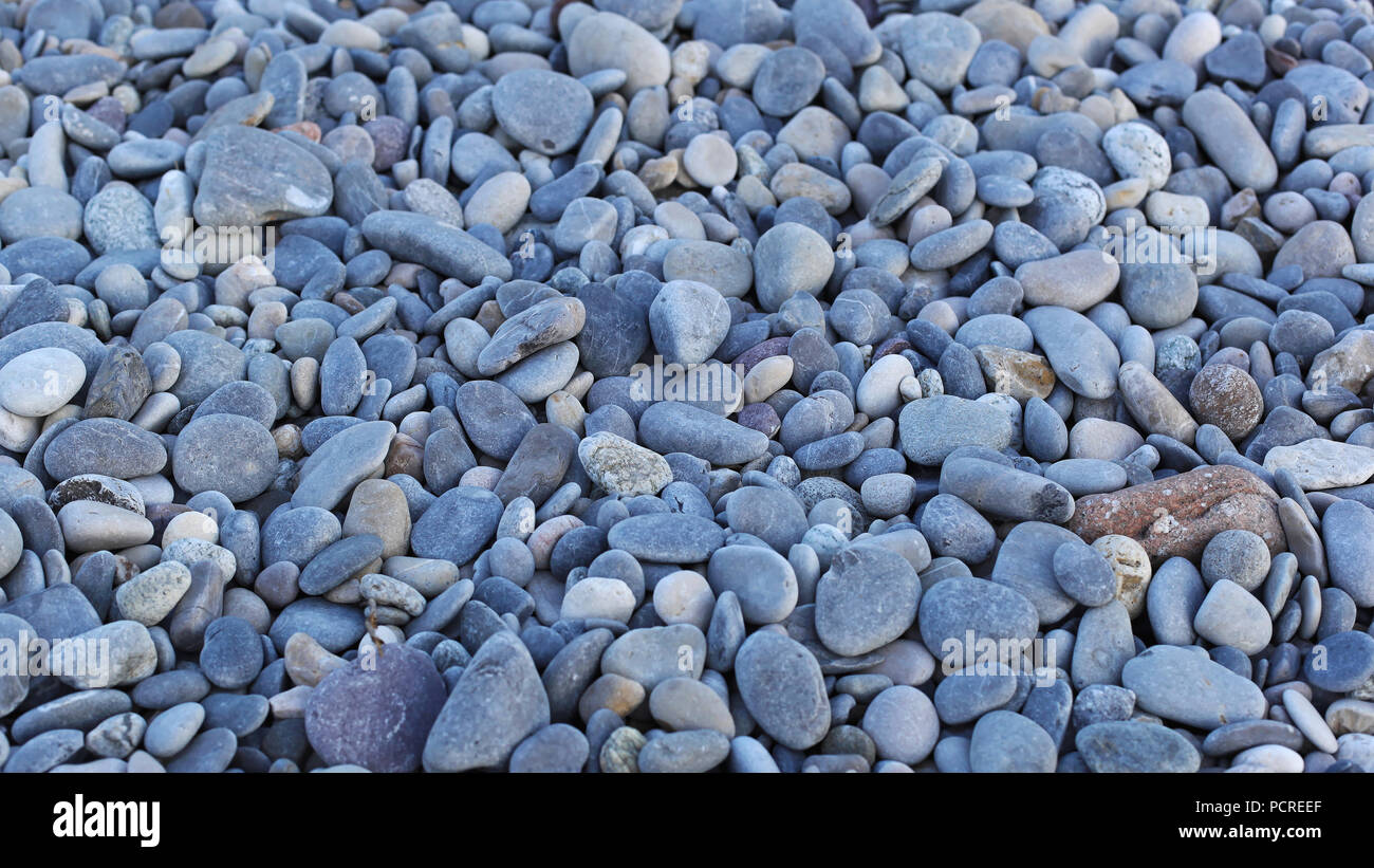 Bunch of pebble stones at beach Stock Photo - Alamy