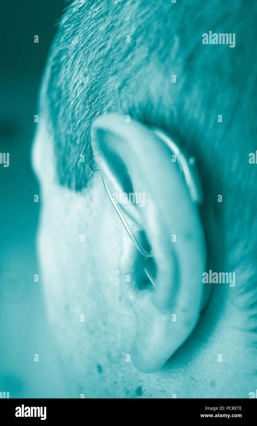 Modern compact in the ear digital audiophone hearing aid in the ear of ...