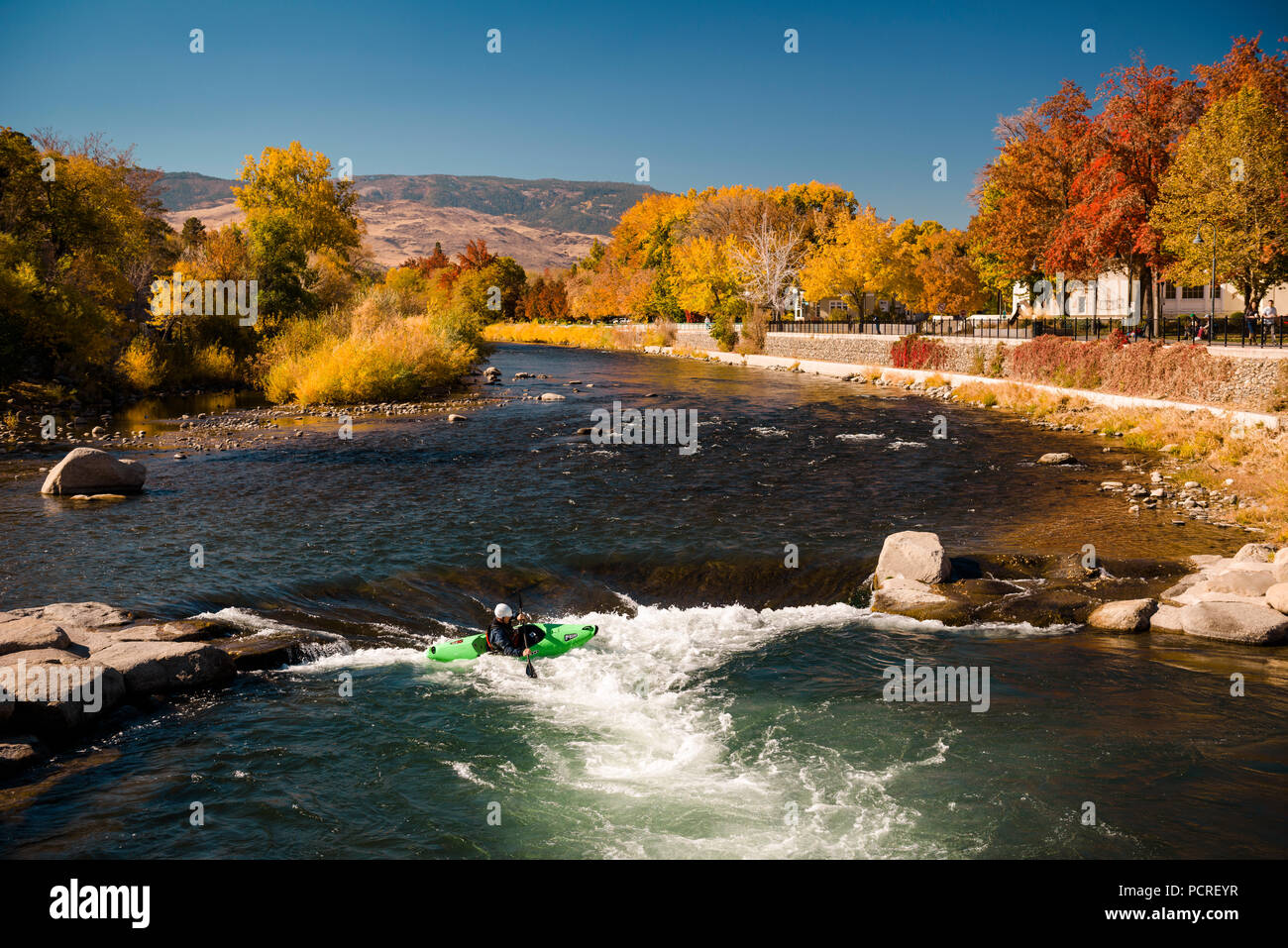 Fall colors and kayaker in Reno whitewater park in downtown Reno ...