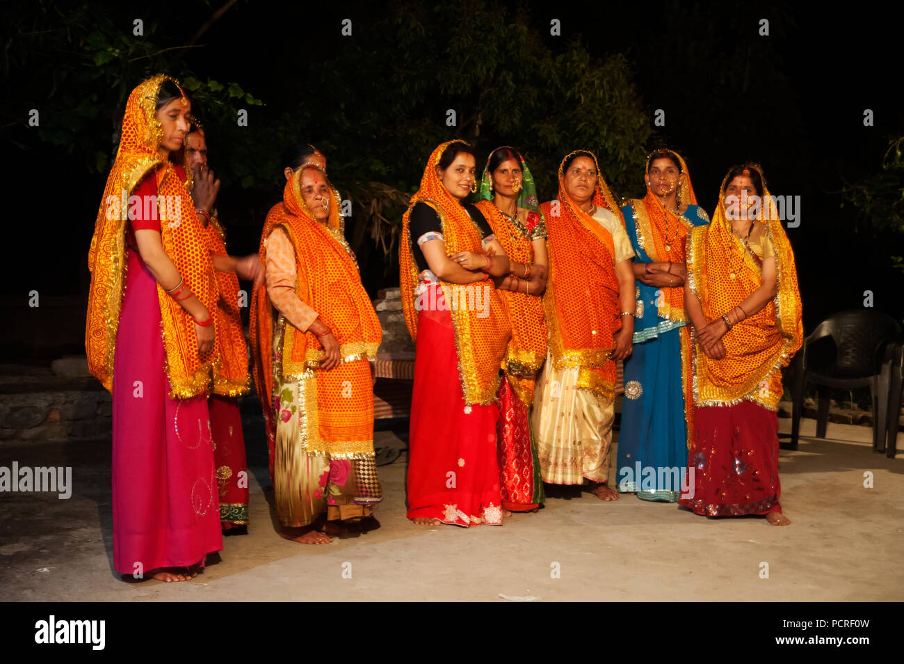 Group of indian womans wearing colorful saris performing a traditional ...