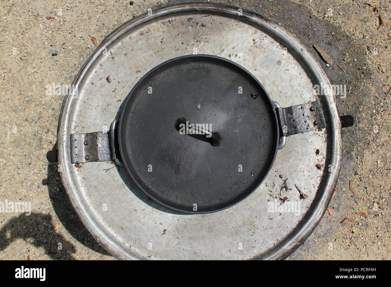 Huge cauldron outside in the open air and on the ground Stock Photo - Alamy