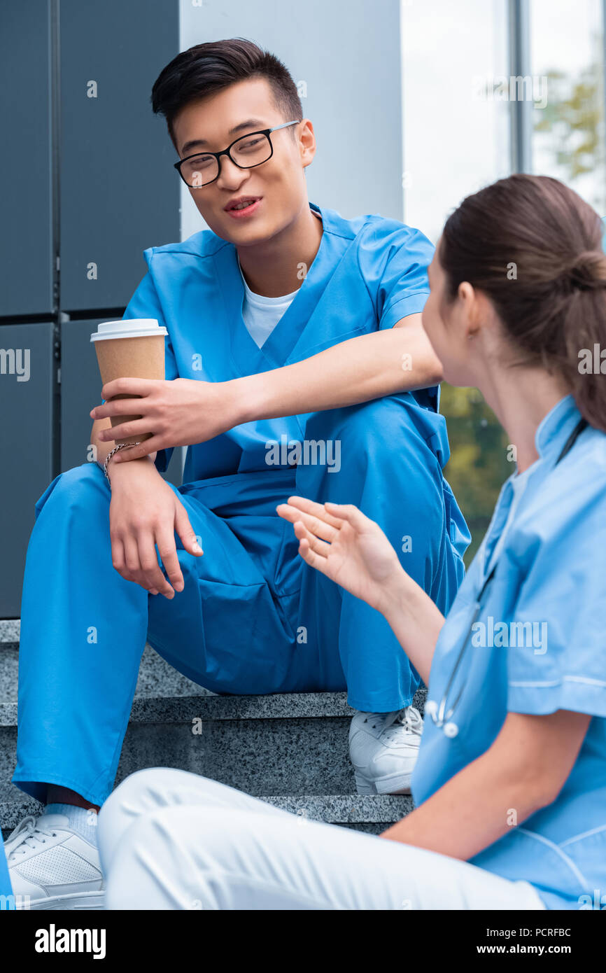 multiethnic medical students talking during coffee break Stock Photo ...