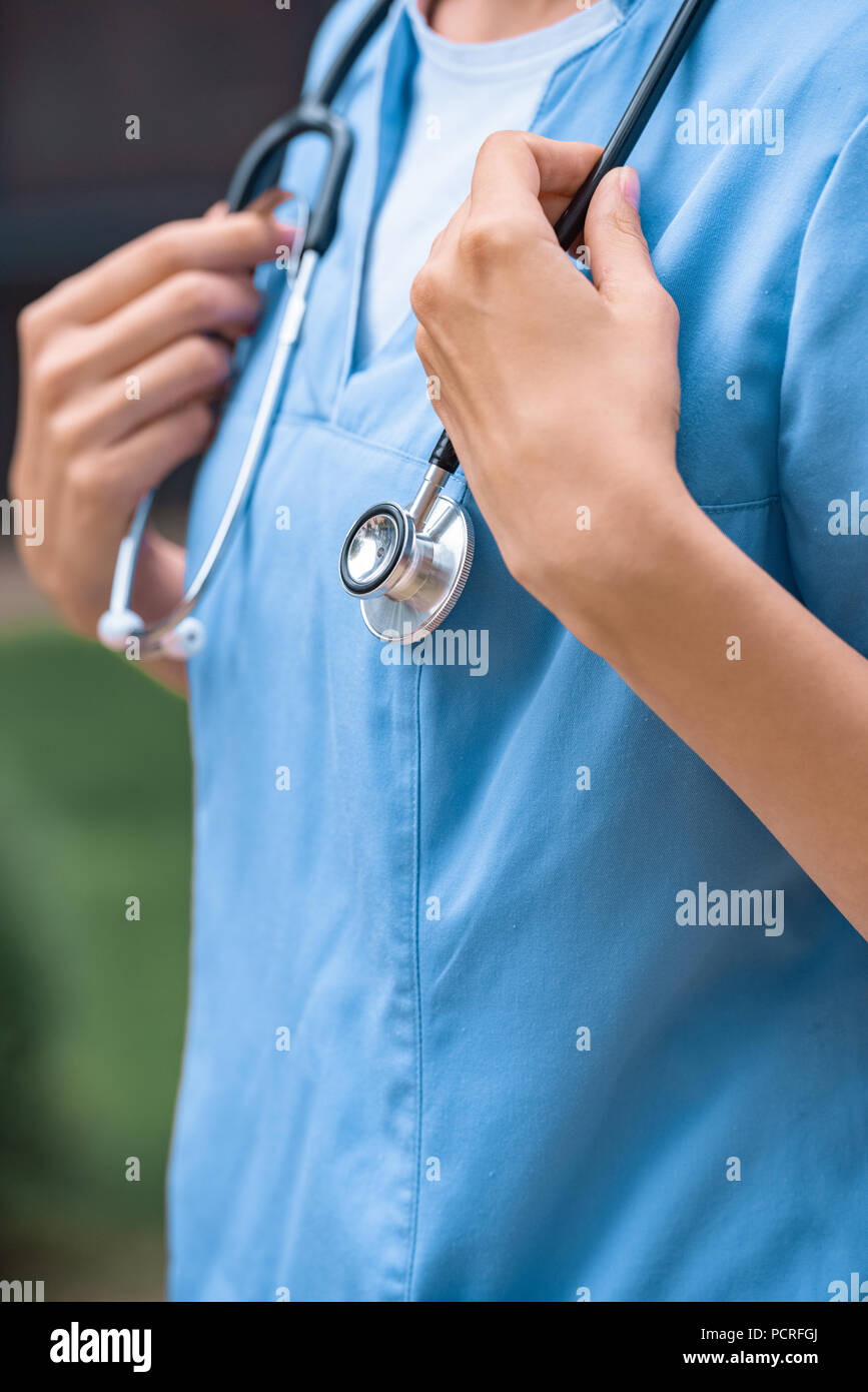 cropped image of medical student touching stethoscope on neck Stock ...