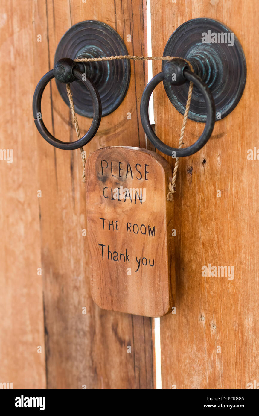 Wooden plate with sign Please clean the room Stock Photo - Alamy