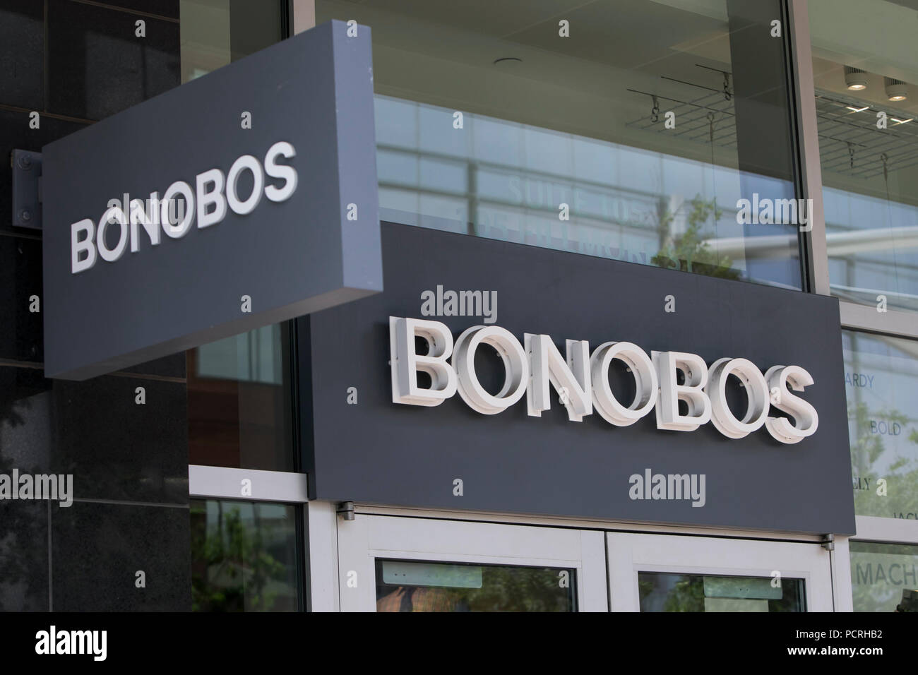 A logo sign outside of a Bonobos retail store location in Denver ...