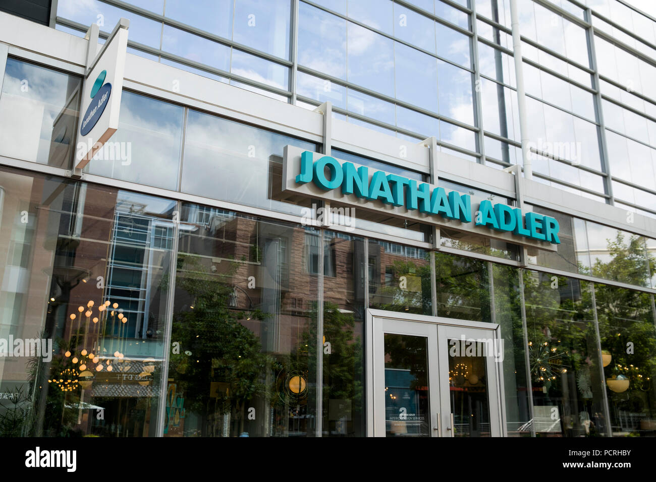 A logo sign outside of a Jonathan Adler retail store location in Denver ...