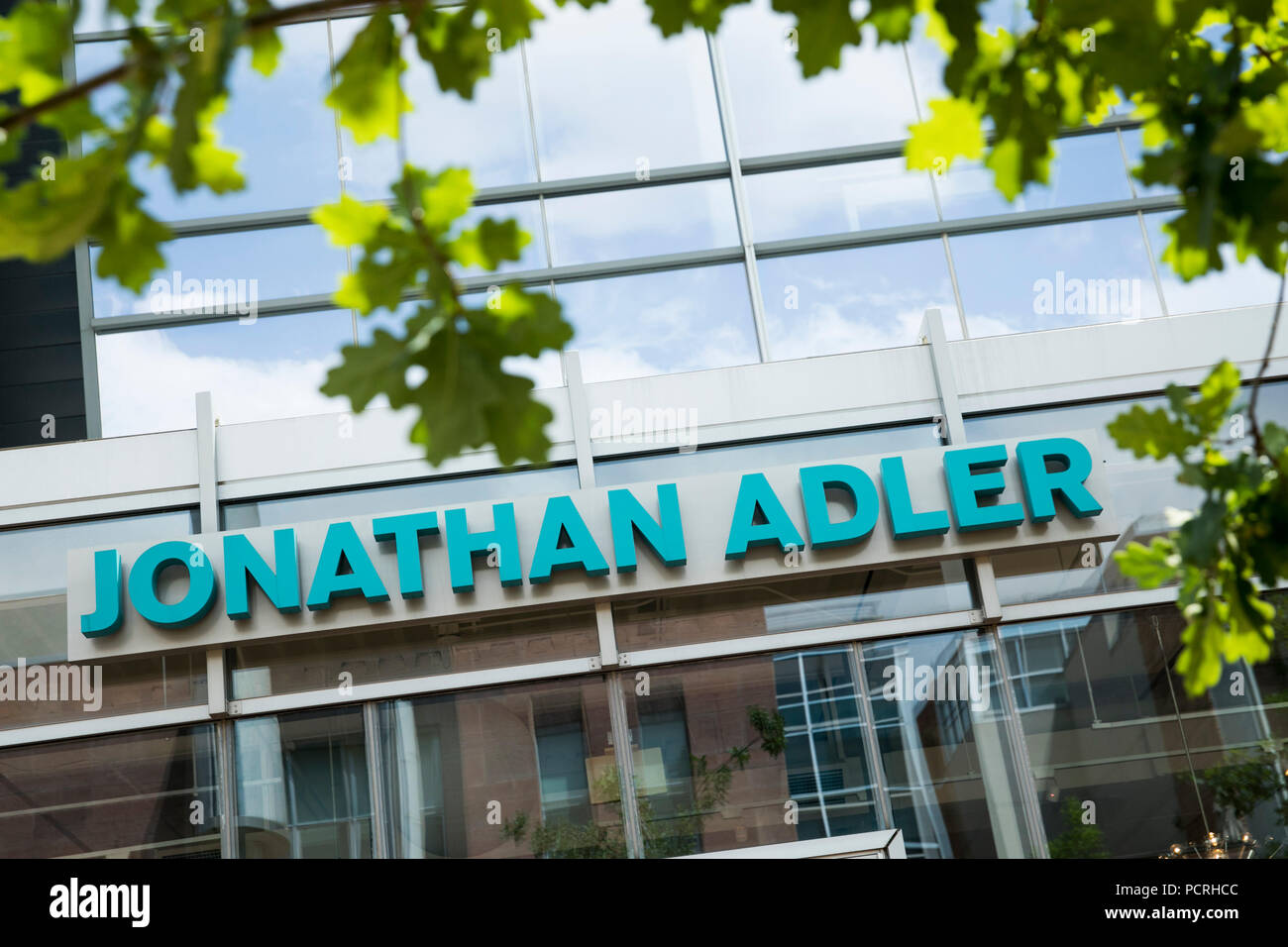 A logo sign outside of a Jonathan Adler retail store location in Denver ...