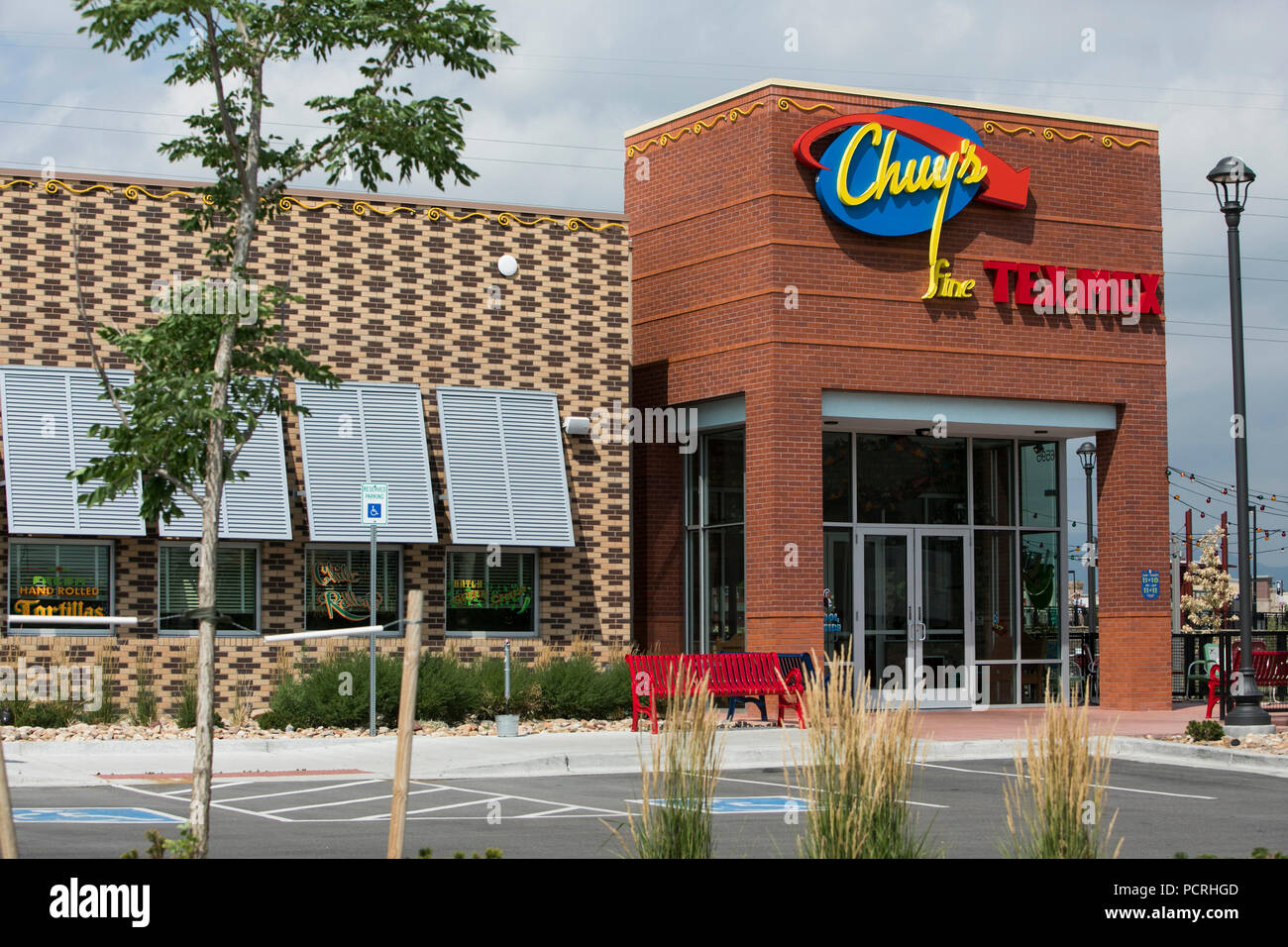 A logo sign outside of a Chuy's restaurant location in Westminster ...